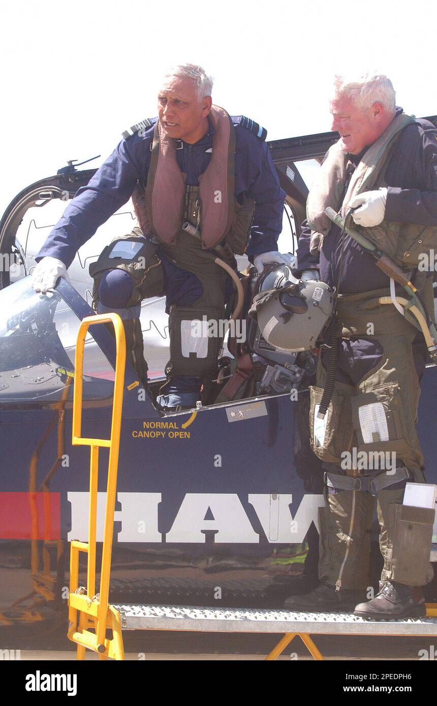 Indian Air Chief marshal S. P. Tyagi, left, climbs out of the cockpit ...