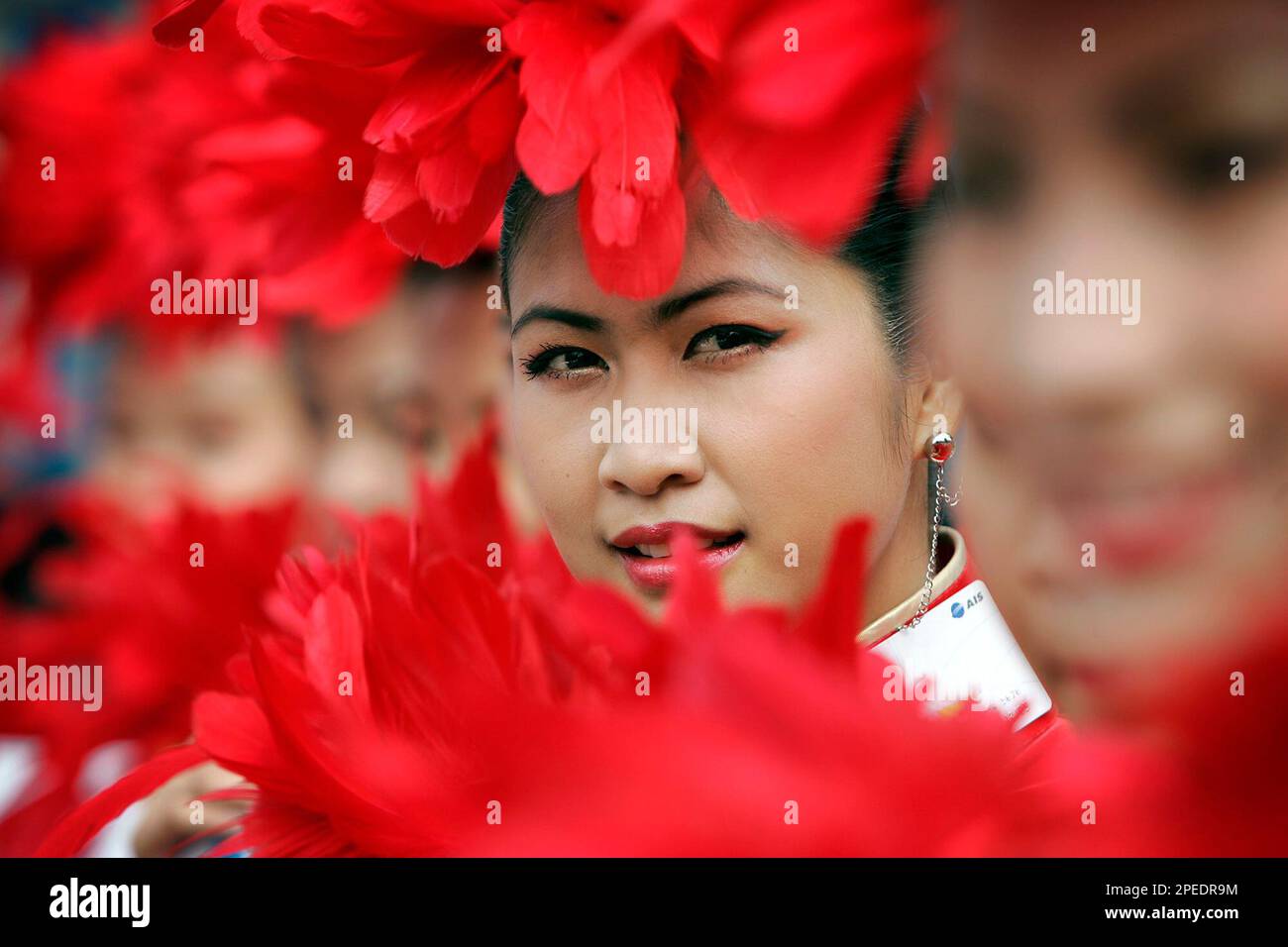 Models dressed in red, the color of good luck, gather as part of New ...