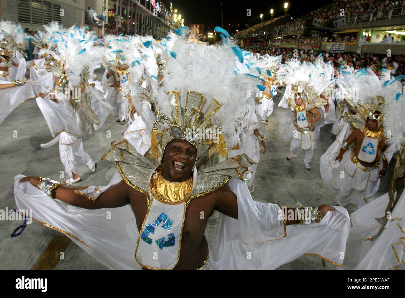 Dancers parade with the Imperio Serrano samba school at the Sambodrome ...