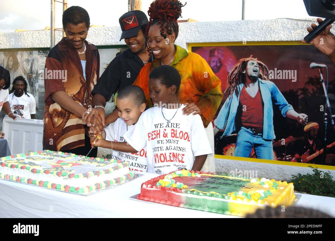 Stephanie Marley, right , daughter of Bob Marley cuts a birthday cake ...