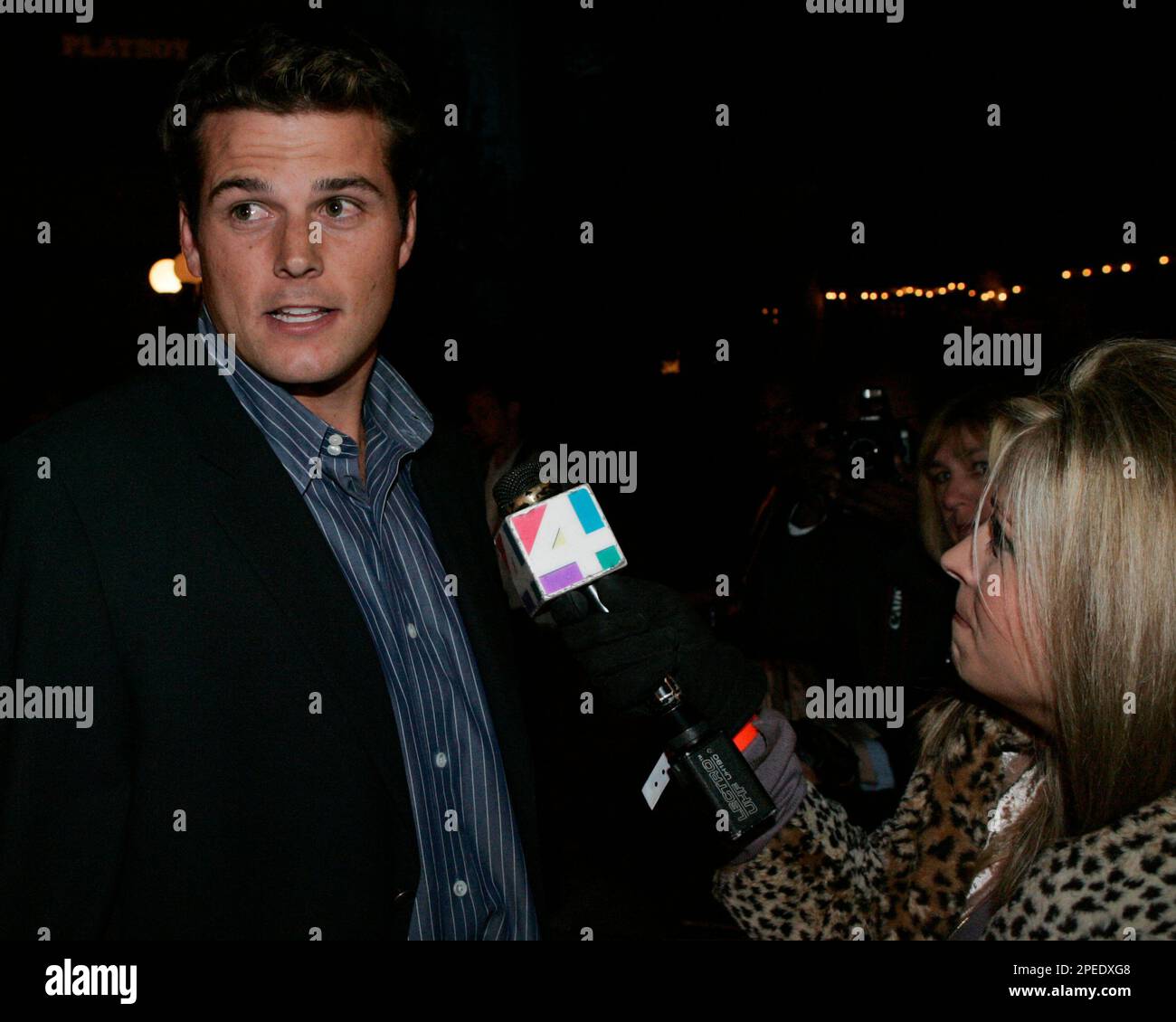 Baltimore Ravens quarterback Kyle Boller talks to a reporter on the red ...
