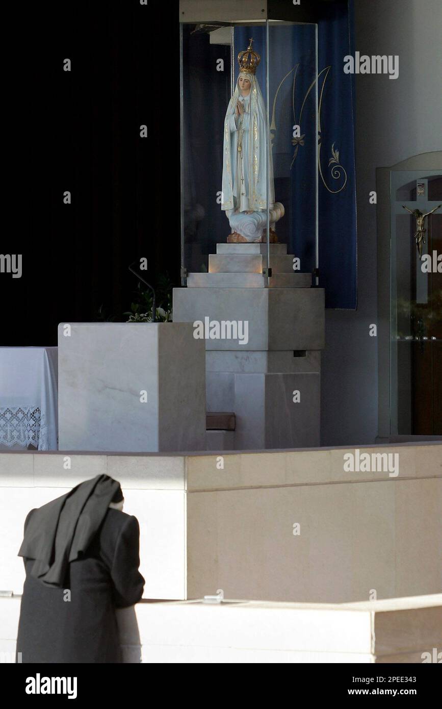 A nun prays in the chapel of Our Lady of Fatima in front of the Our ...