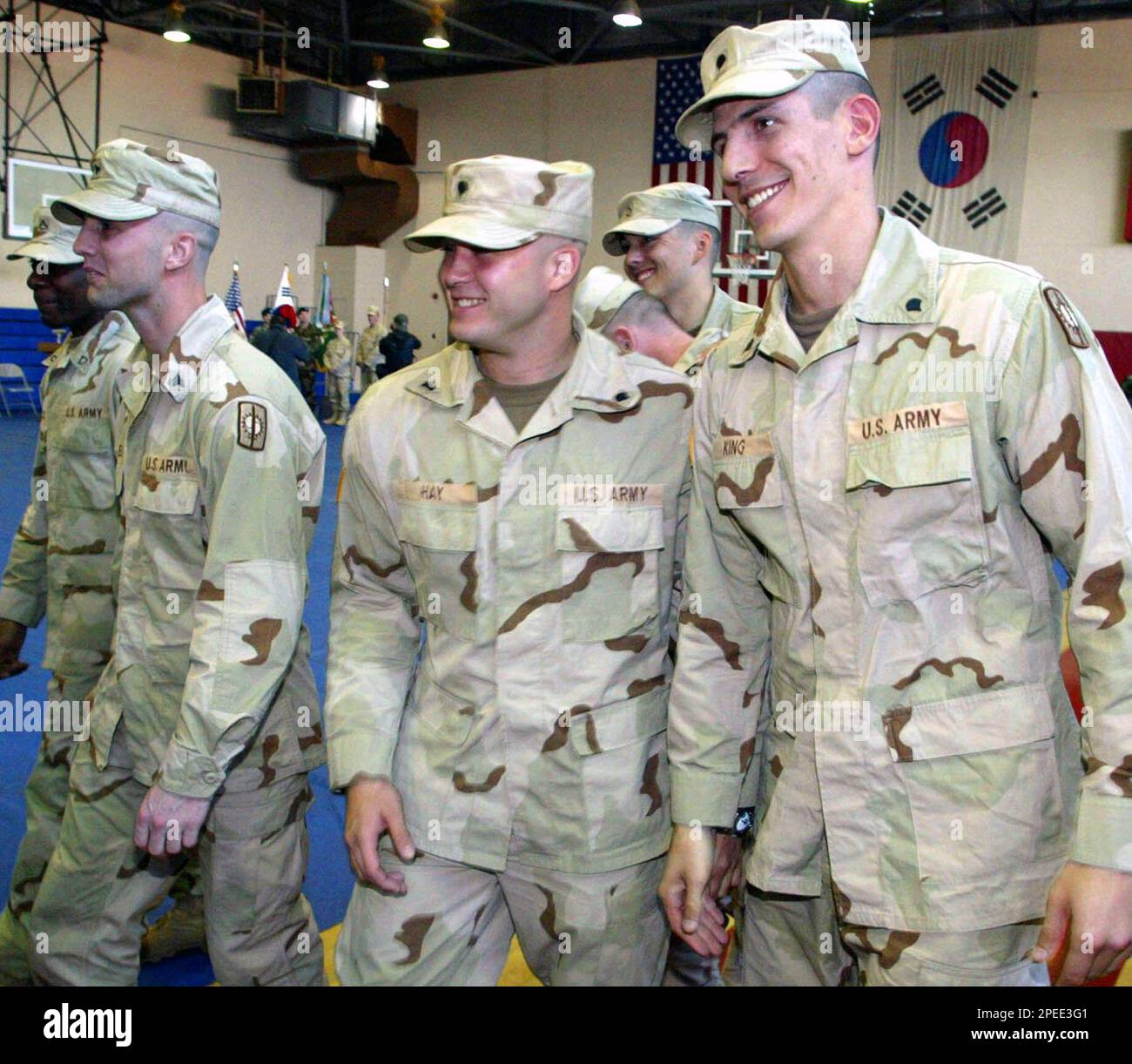 U.S. troop personnel of 728th Military Police Battalion walk past with ...