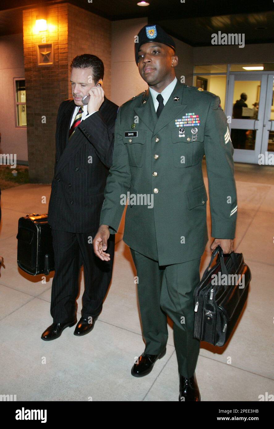 Sgt. Javal S. Davis, right, and his attorney Paul Bergrin leave the ...