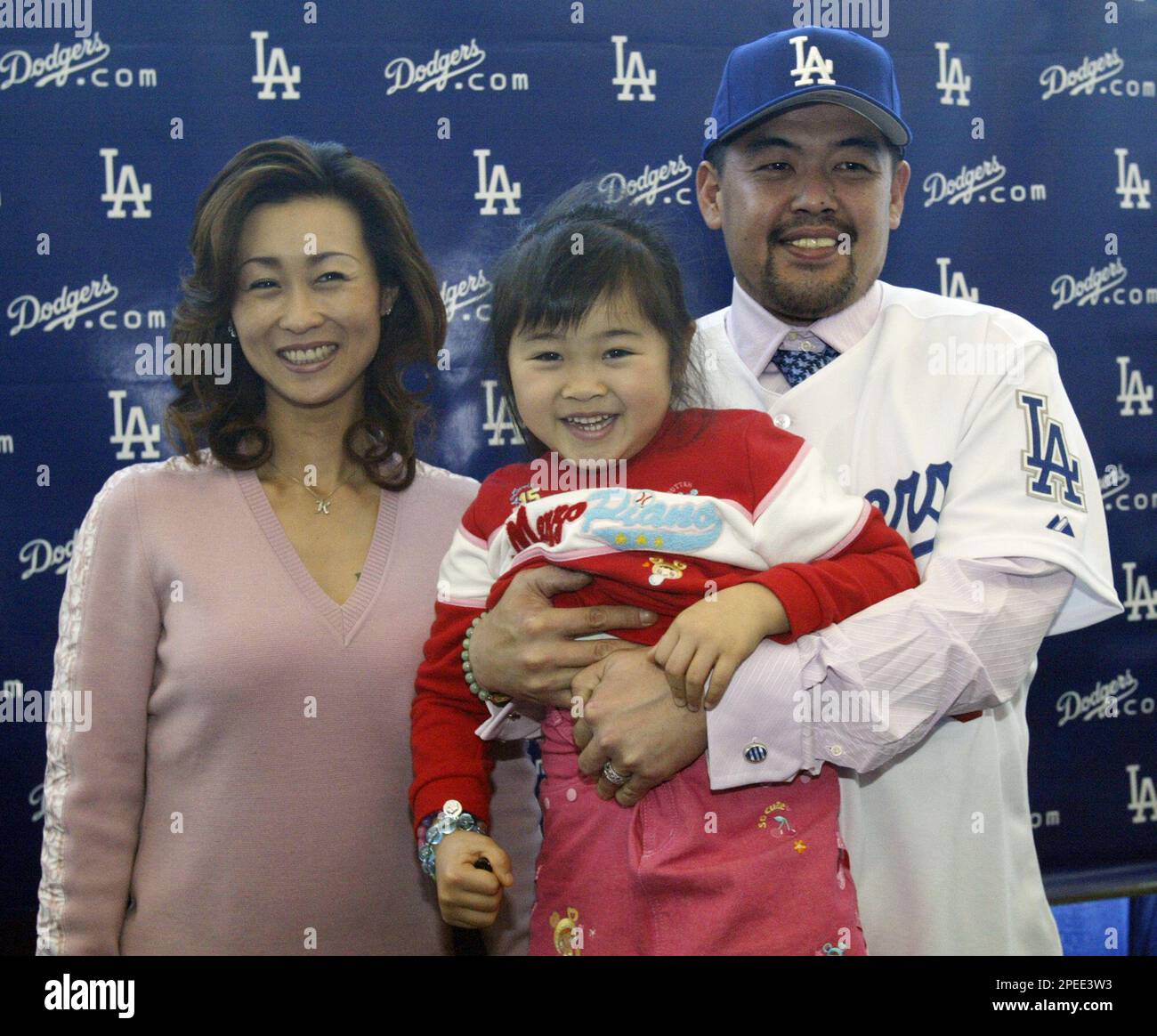 Japanese third baseman Norihiro Nakamura, right, poses with his wife ...