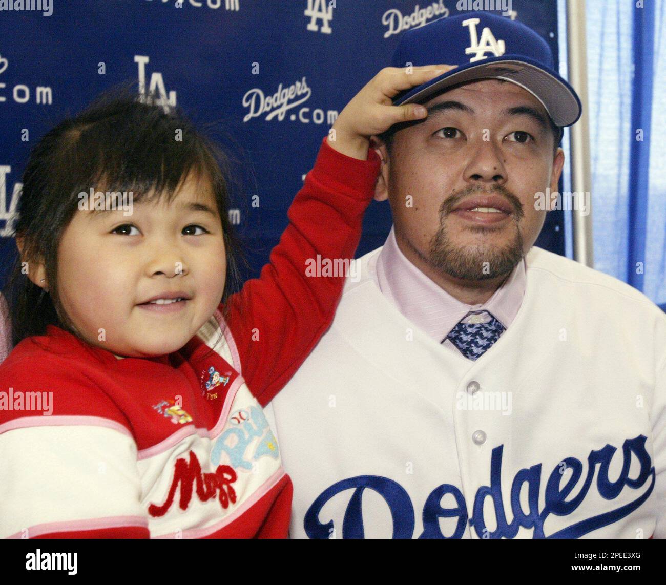 Japanese third baseman Norihiro Nakamura poses with his daughter Erika ...