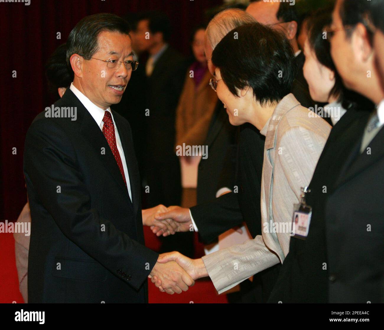 New Taiwan Premier Frank Hsieh, left, shakes hands with his Cabinet ...