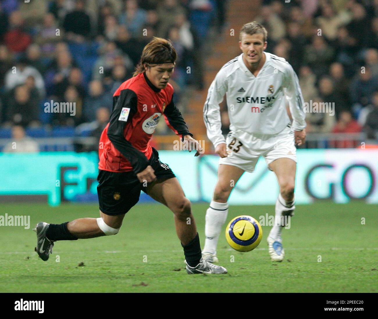 Mallorcas new Japanese player Yoshito Okubo, left, takes the ball past ...