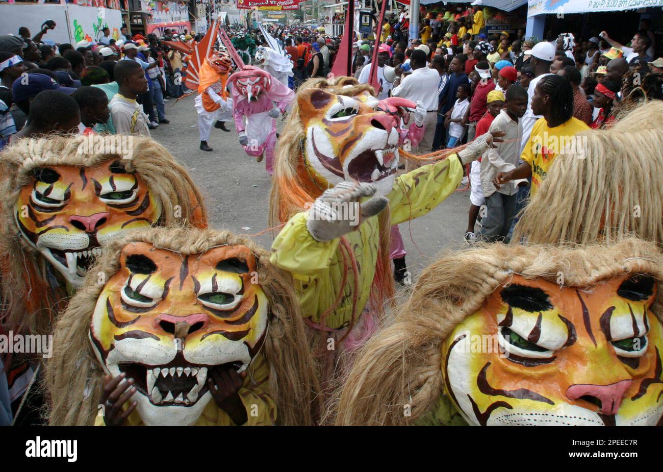 A group of Haitians dressed in tiger costumes participate in the ...