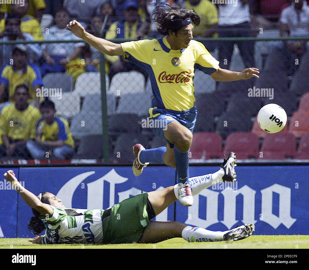 America's soccer Player Mario Perez, top, fight for the ball by Santos ...