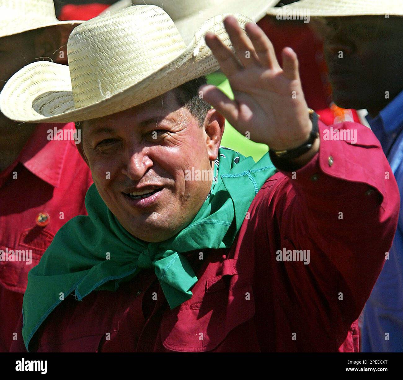 Venezuelan President Hugo Chavez waves during a visit to a Brazilian ...