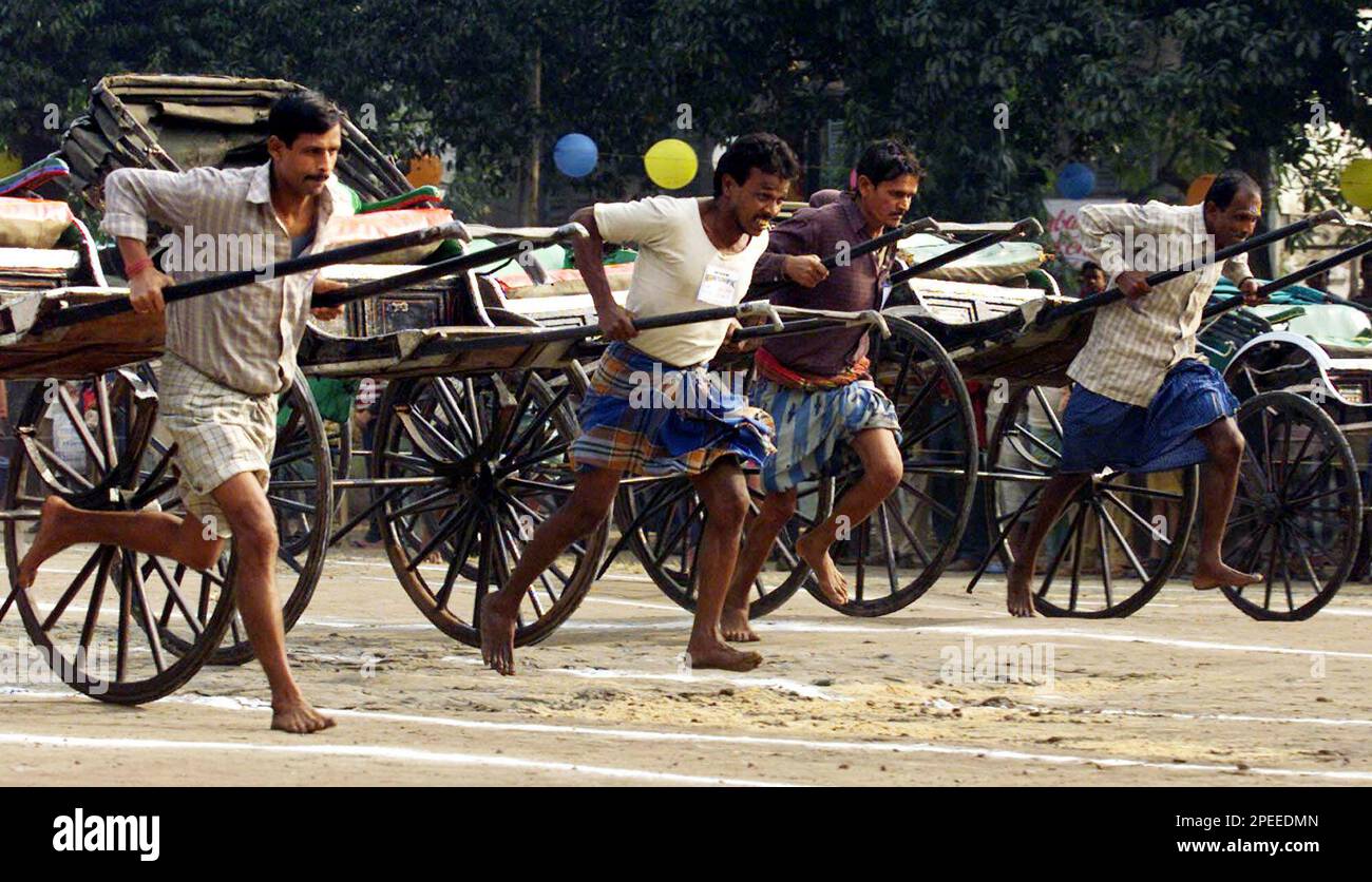 Rickshaw pullers compete during the first hand-pulled rickshaw race in ...