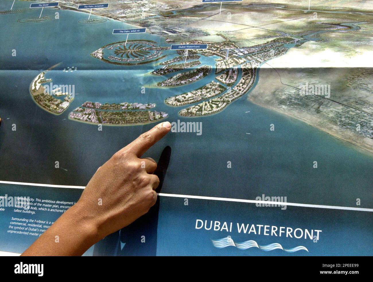 Emirates-Mega-Project. A woman points to the image of the Dubai ...