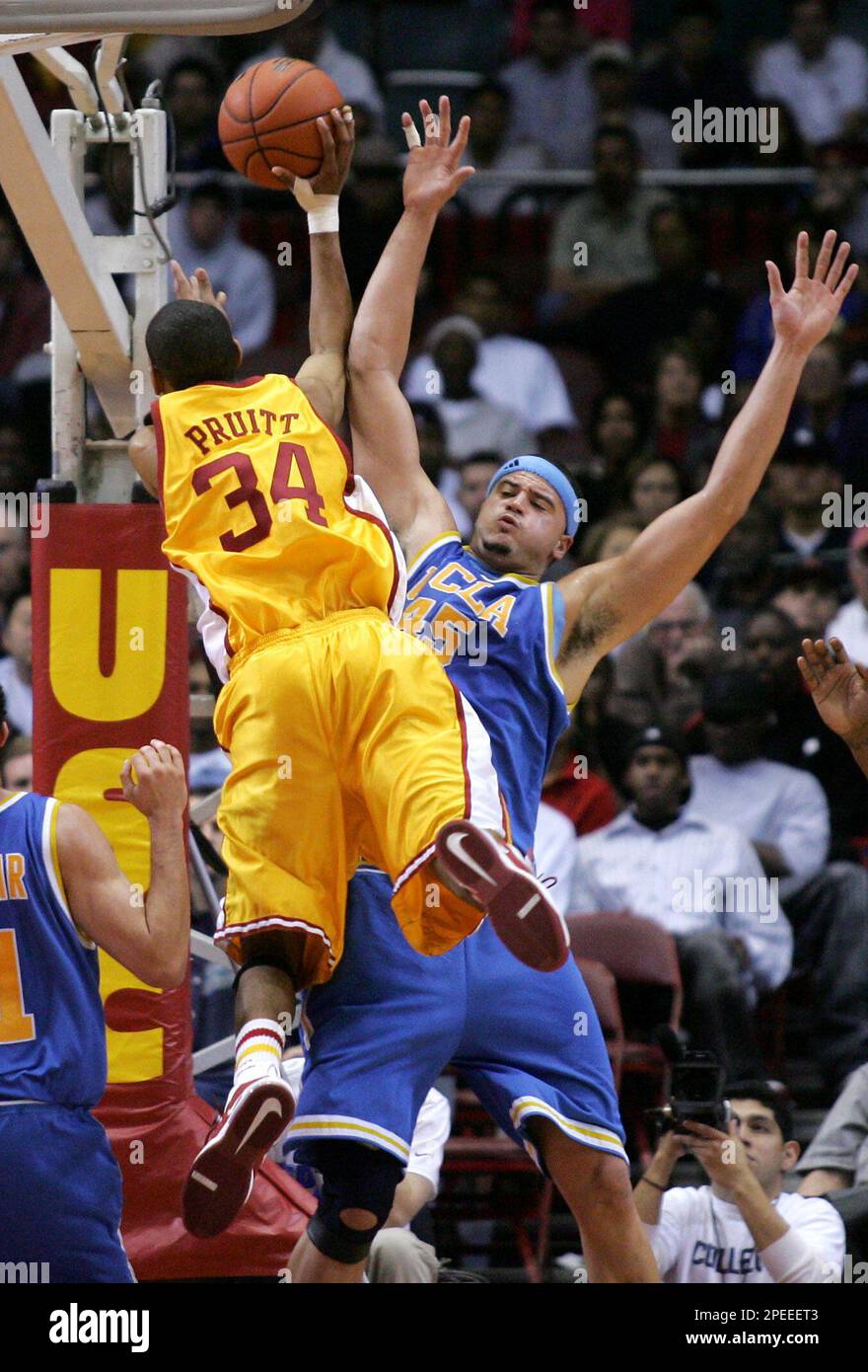 UCLA's Michael Fey, right, stands his ground as he prevents Southern ...