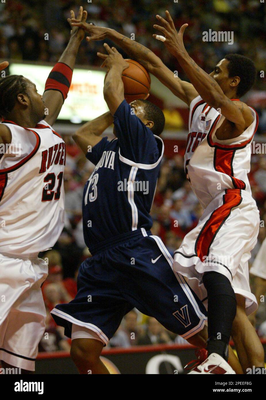 Villanova's Kyle Lowry (13) shoots past Rutgers' Byron Joynes (21) and ...