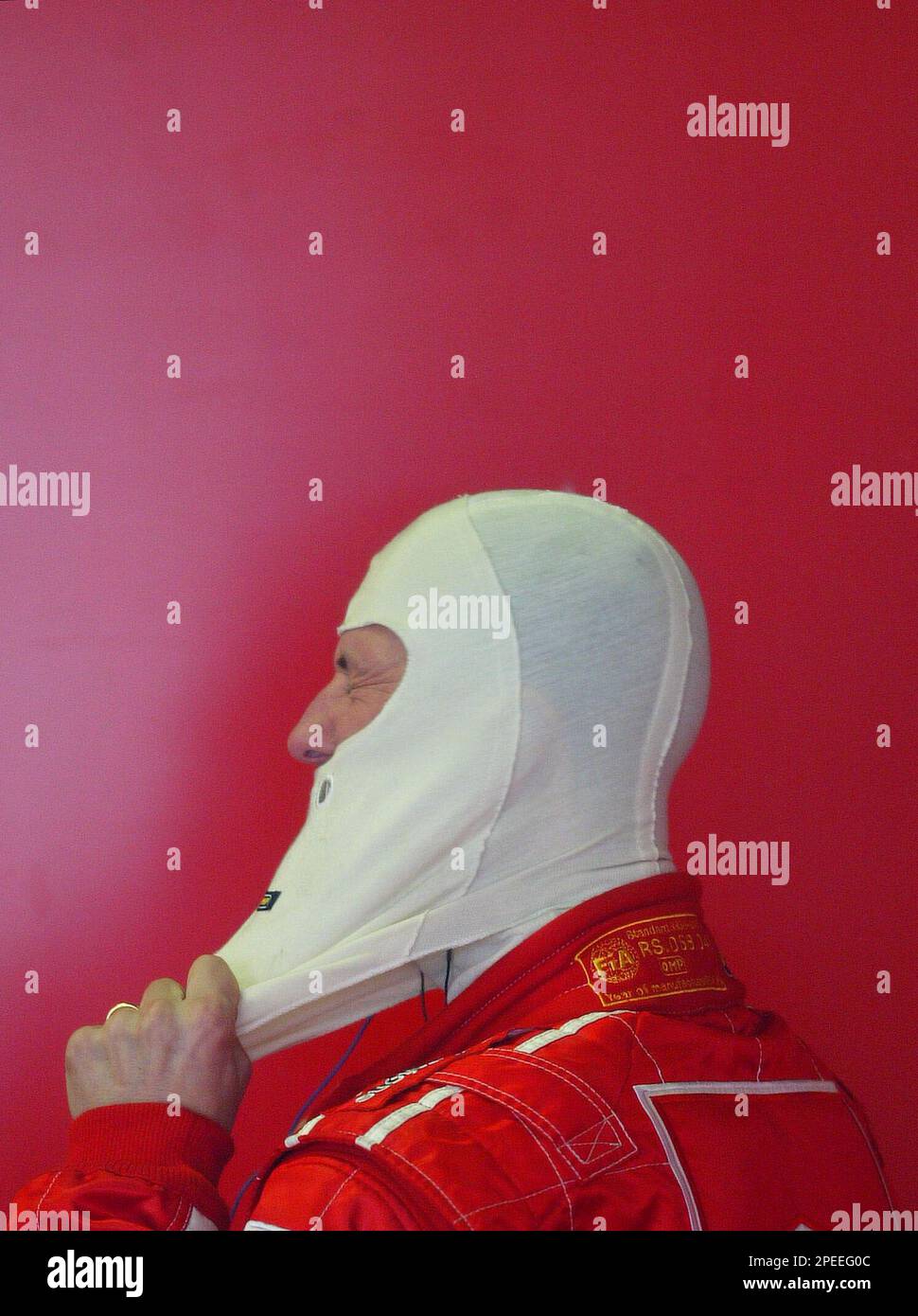 German Formula One driver Michael Schumacher puts on a balaclava during ...