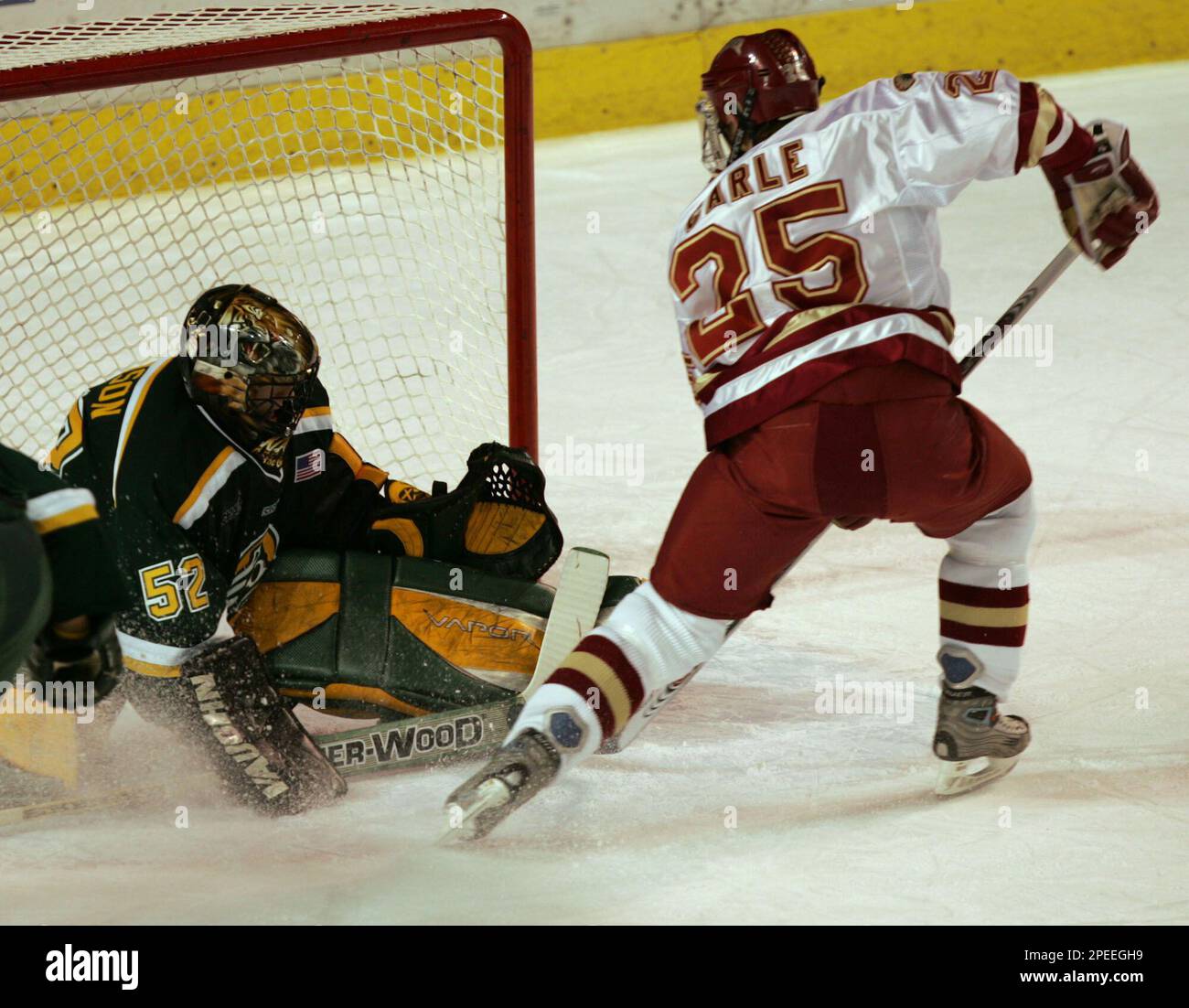 Denver defenseman Matt Carle, right, puts a shot past Alaska-Anchorage ...