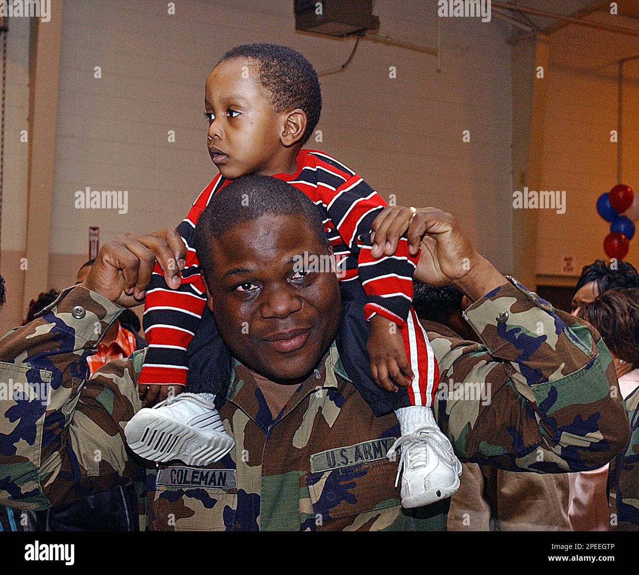 Staff Sgt. Donald Coleman carries his 2-year-old son, Donald Jr. around ...