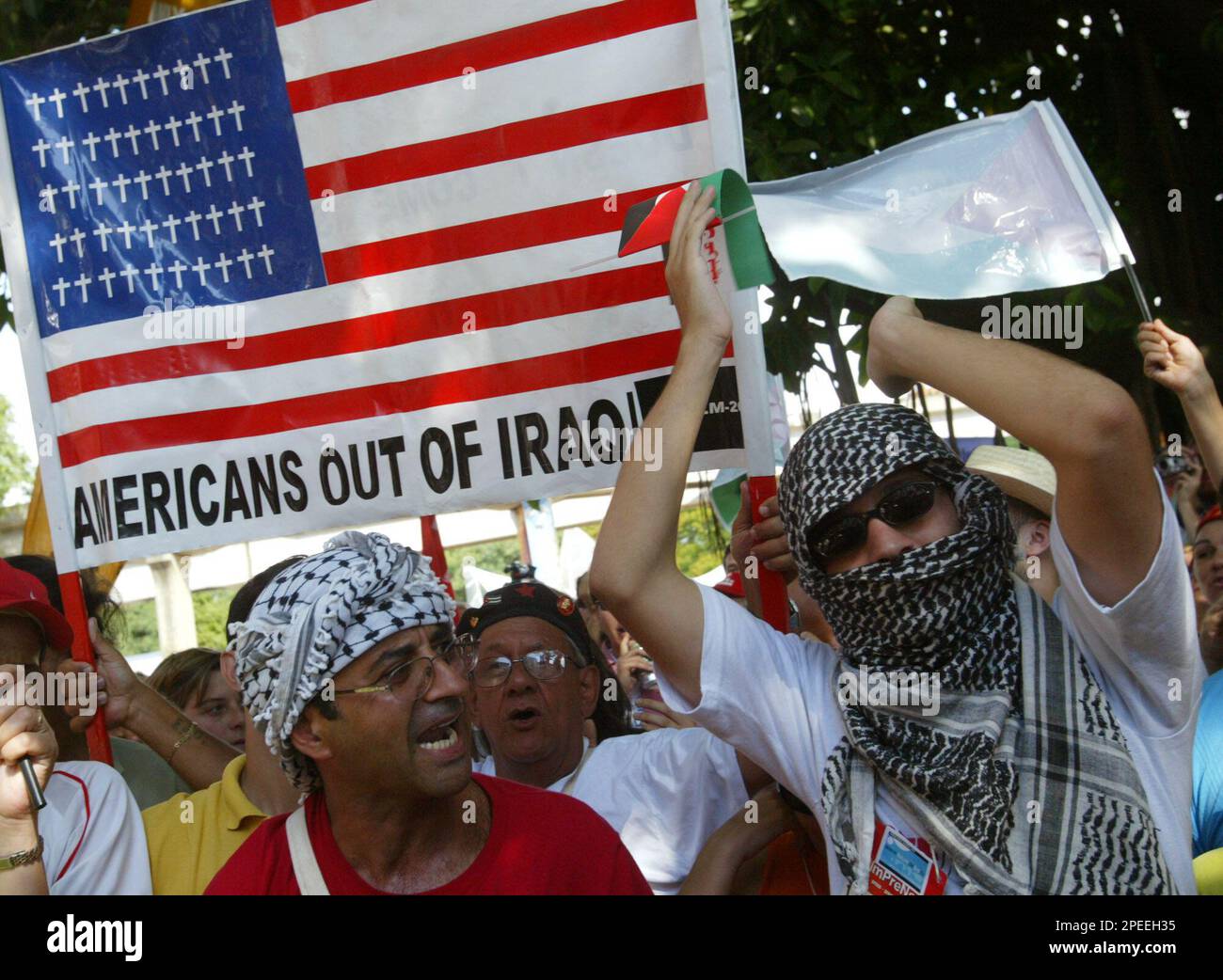 Supporters of Palestinians rights, hold a banner as they shout anti ...