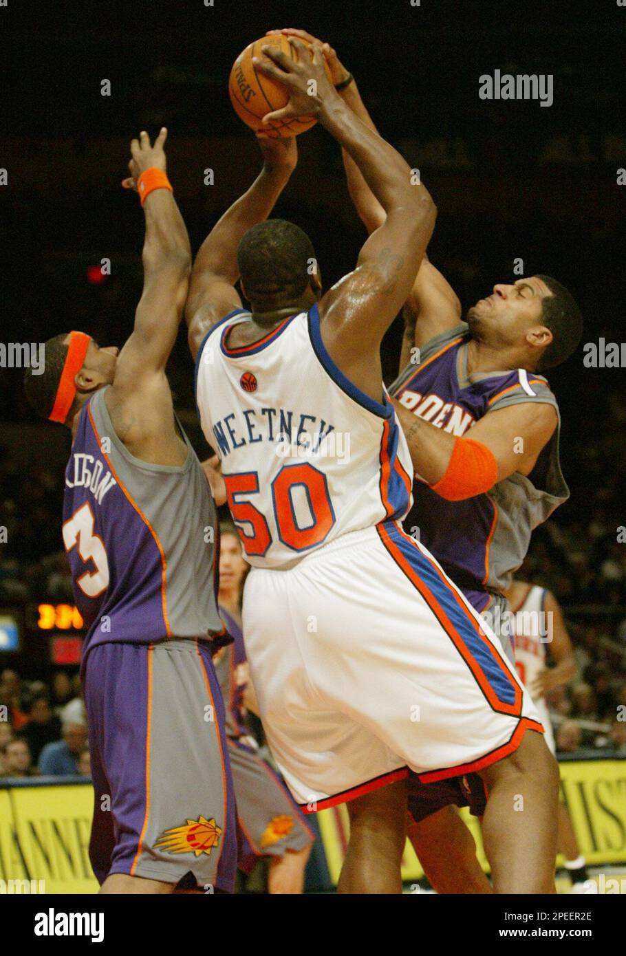 Phoenix Suns Quentin Richardson, left, and Jim Jackson, right, double ...