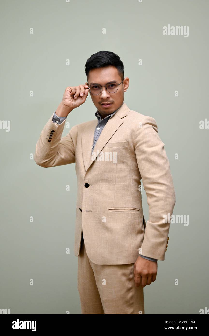 Determined and confident millennial Asian businessman or male CEO in ...