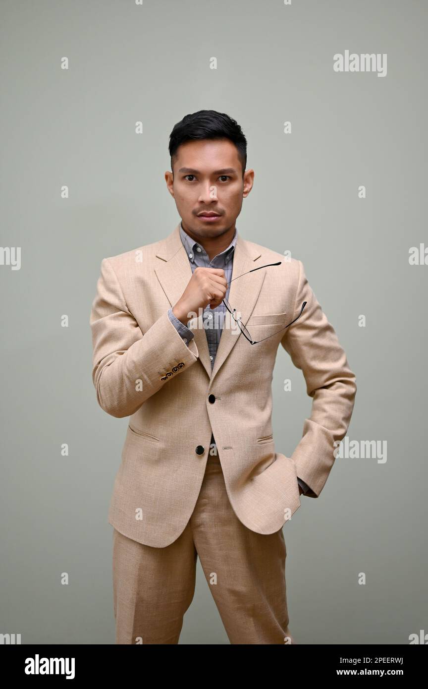 Serious and strict millennial Asian male boss or businessman in formal ...