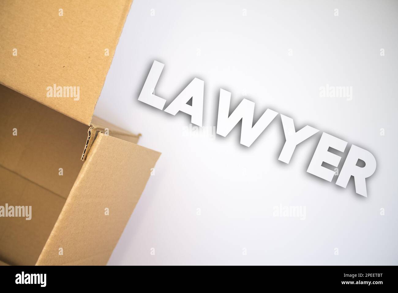 Lawyer word with cardboard box. Brown folded card box Stock Photo - Alamy