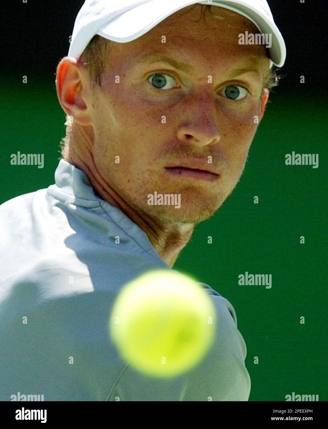 Russia's Nikolay Davydenko looks to make a backhand return during his ...