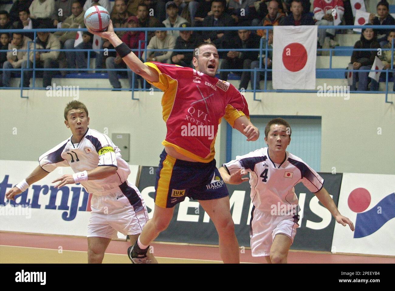 Spain's David Barrufet, center, jumps to shoot as Japan's Yuiochi ...