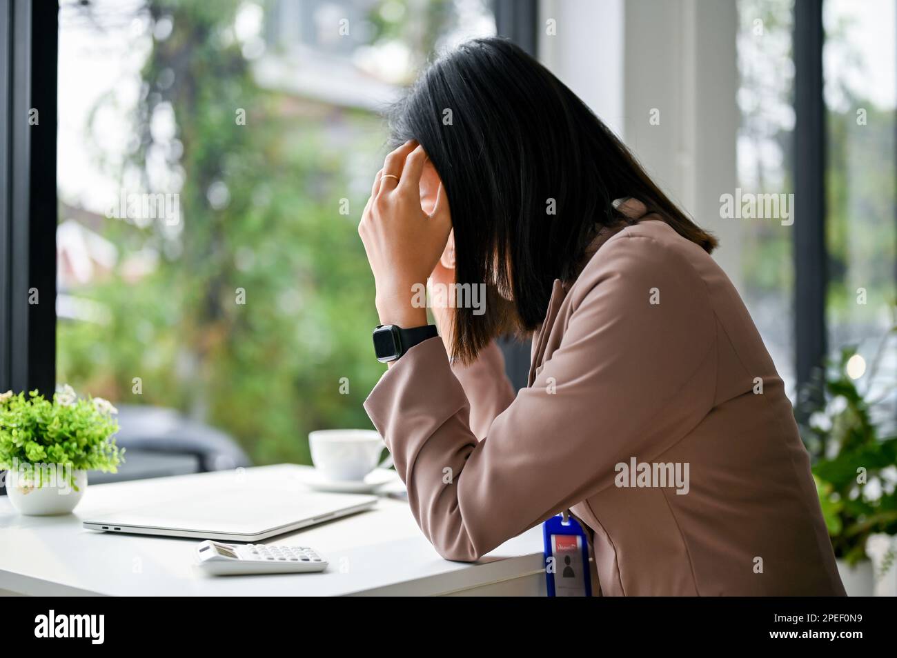 Stressed and serious millennial Asian businesswoman or female office ...