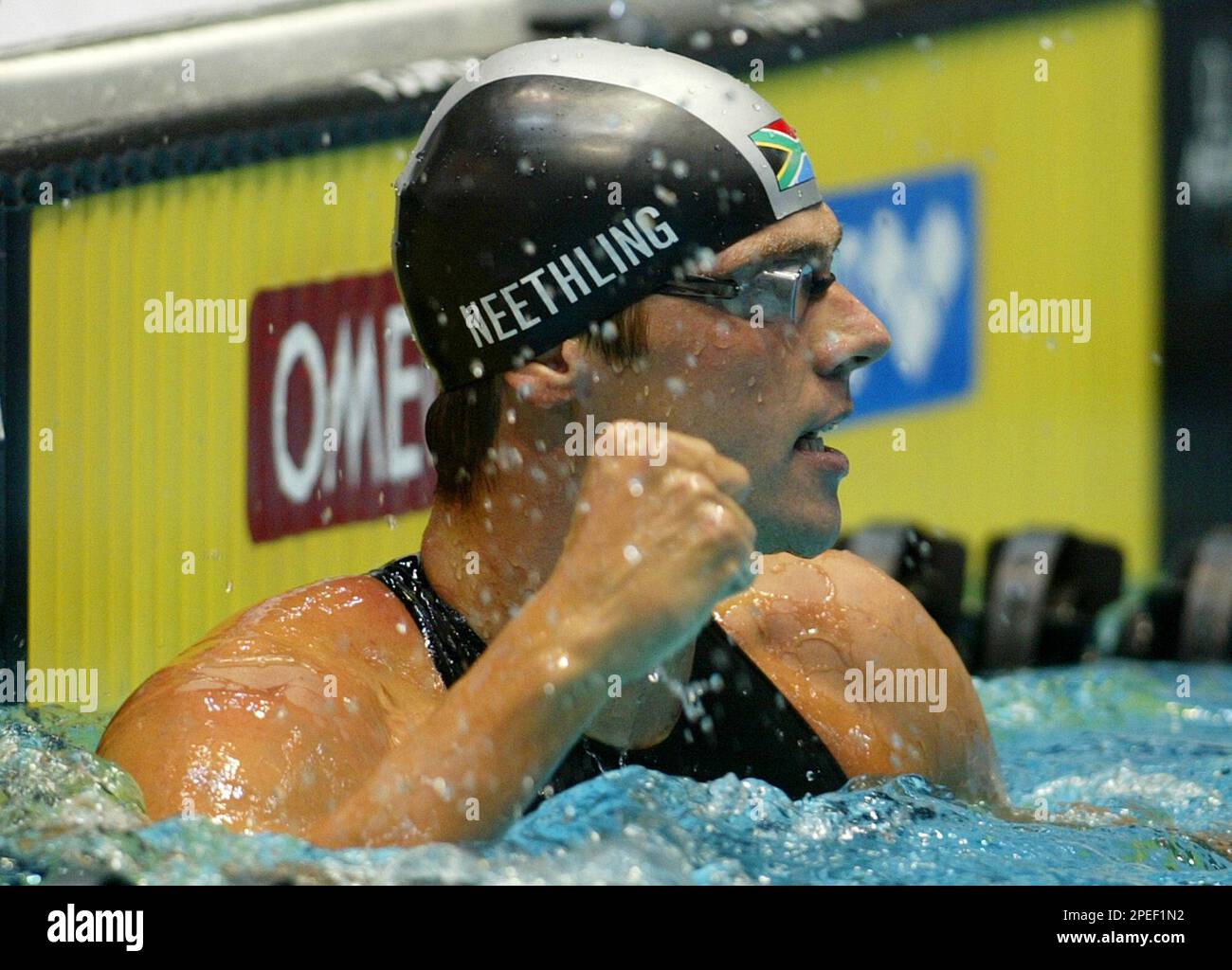 South African swimmer Ryk Neethling cheers after his world record in the 100m individual medley ...