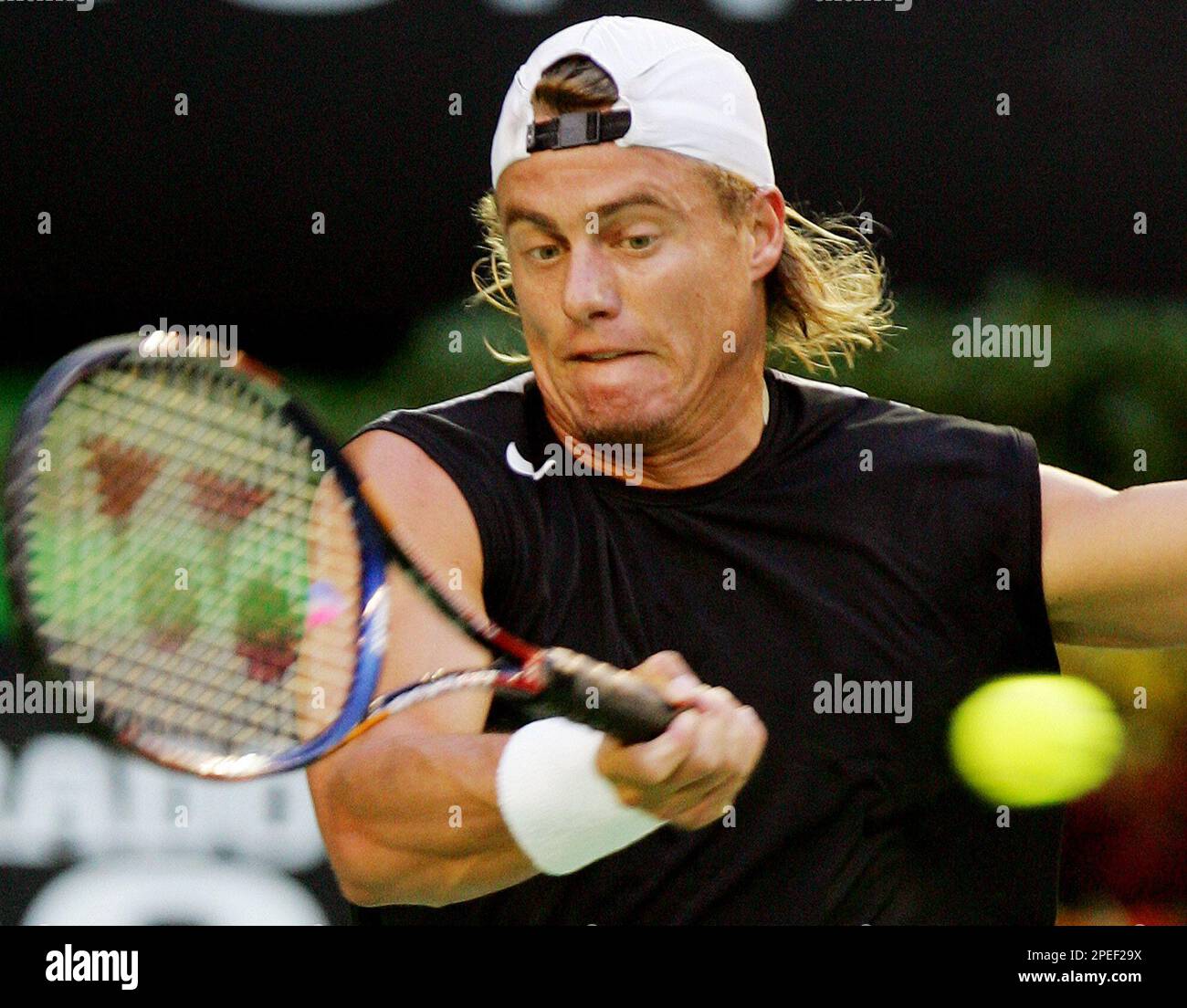 Australia's Lleyton Hewitt makes a forehand return during his third ...