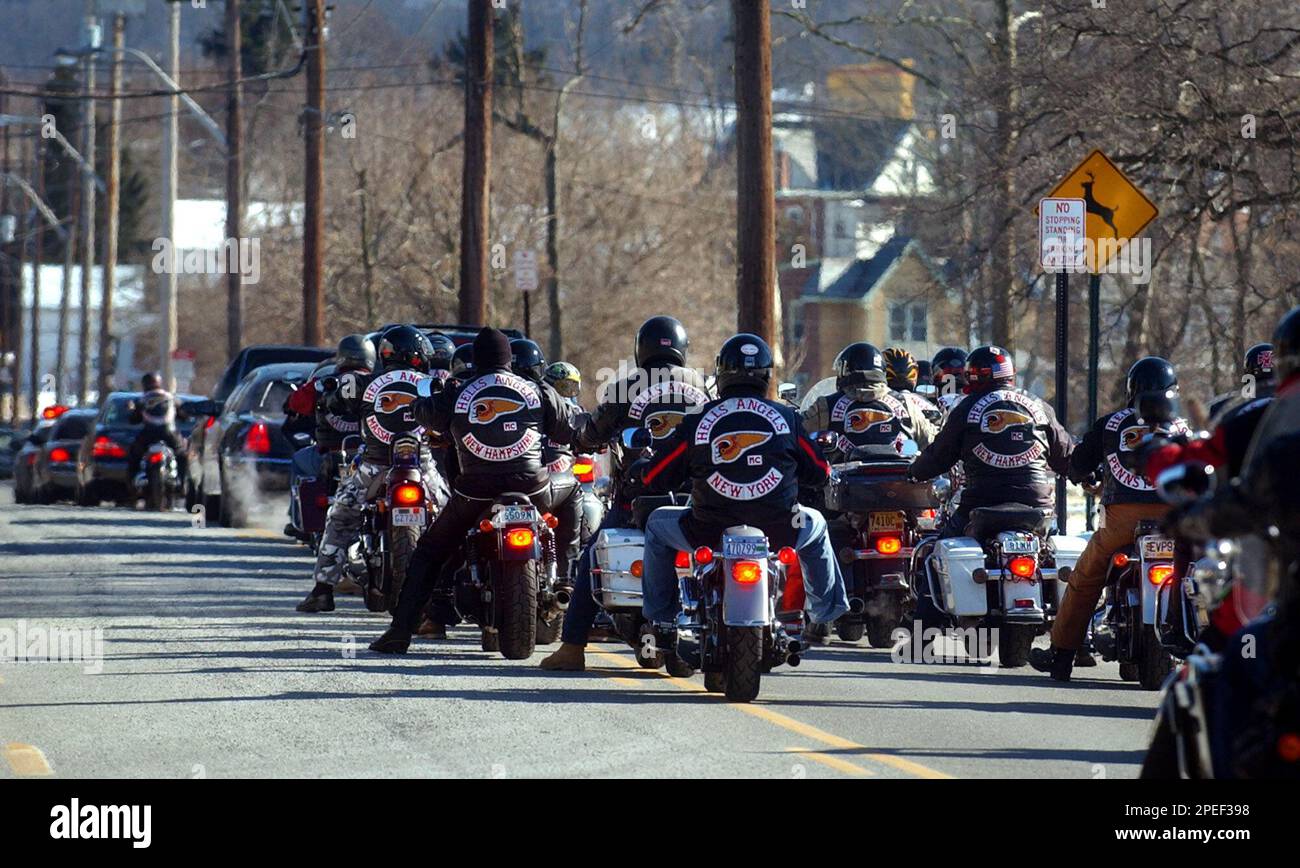 Members of the Hells Angels escort the hearse carrying the body of ...