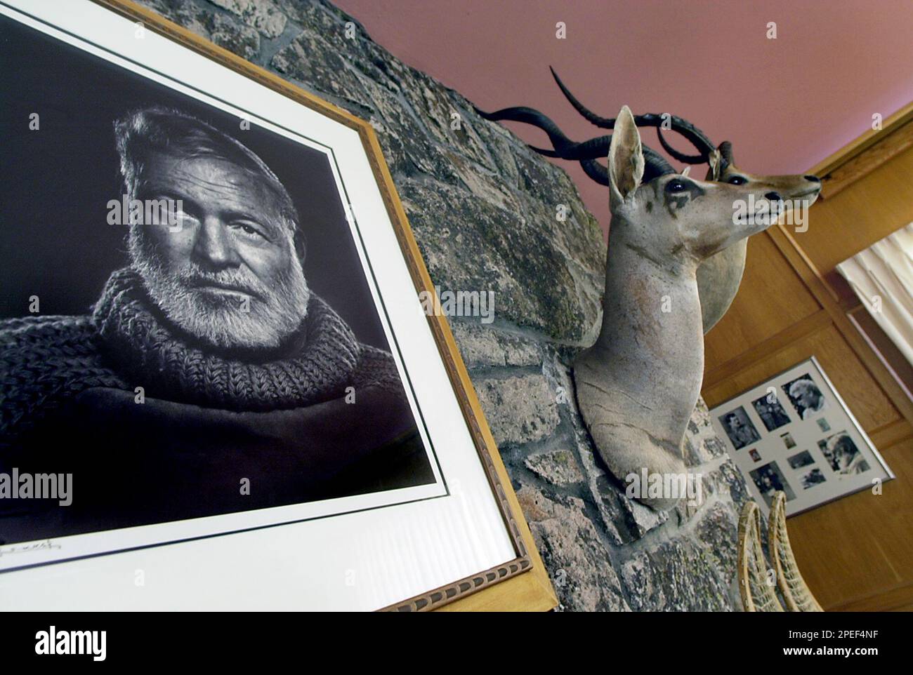 A portrait of Ernest Hemingway hangs above the fireplace in his home ...
