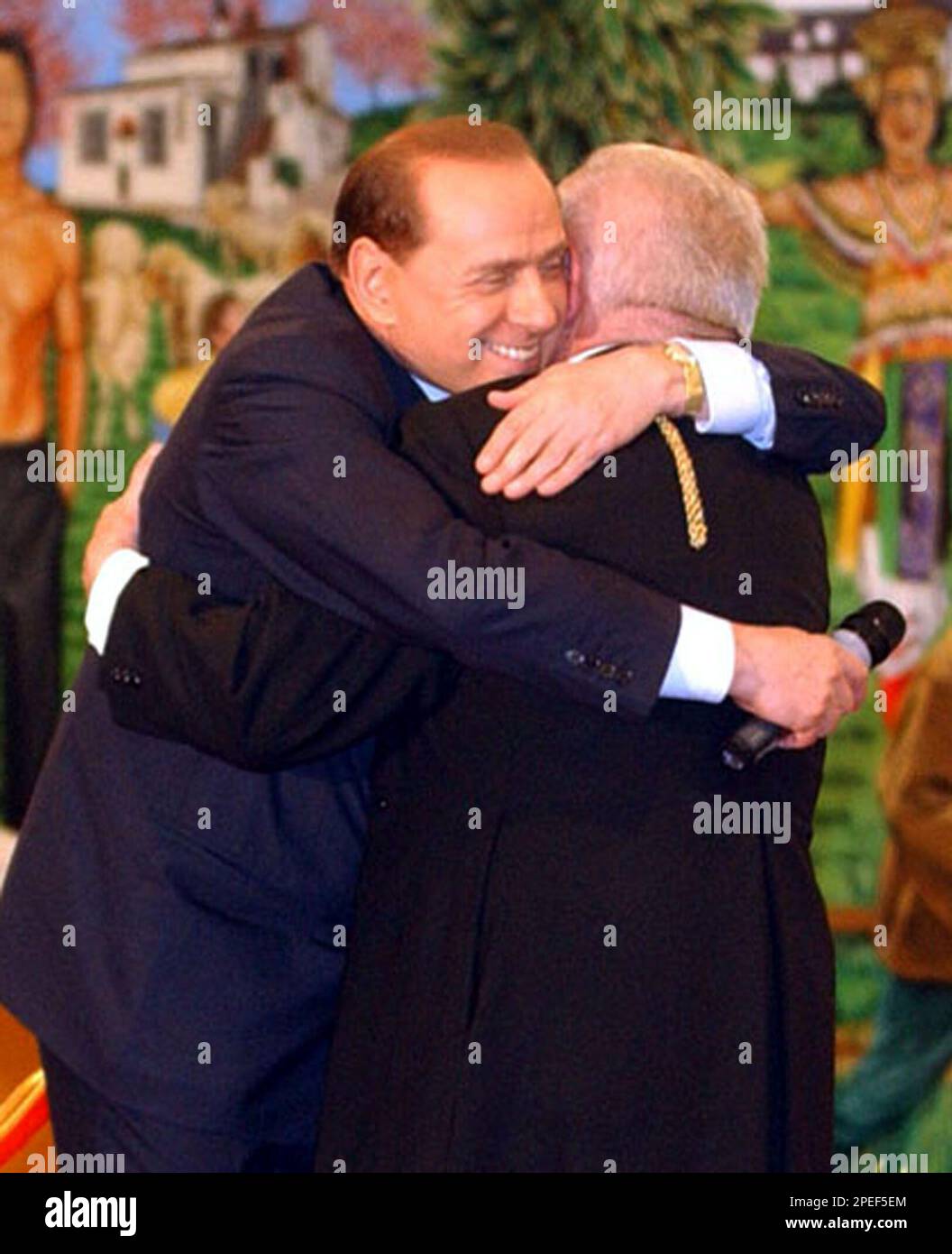 Silvio Berlusconi embraces Don Gelmini in Amelia, Italy, Thursday, Jan ...
