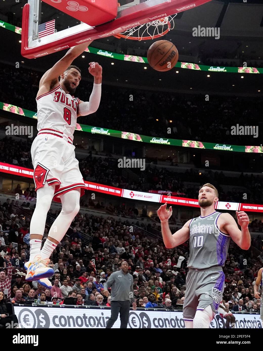 Chicago Bulls' Zach LaVine dunks as Sacramento Kings' Domantas Sabonis ...