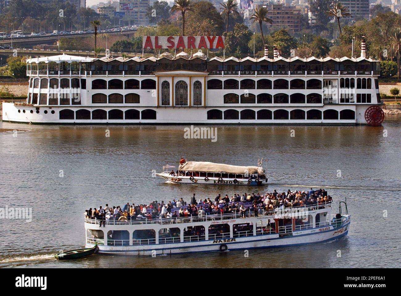 Egyptians enjoy a day of boating along the Nile River in Cairo, Egypt ...