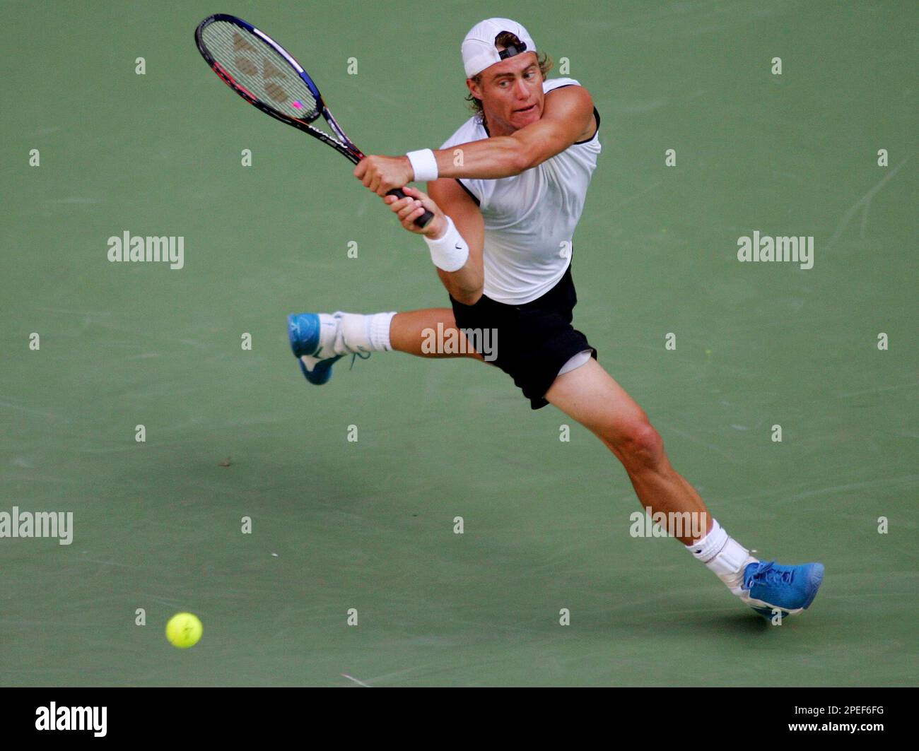 Australia's Lleyton Hewitt plays a backhand return on Rod Laver Arena ...