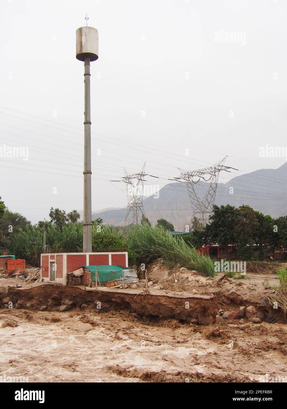 The overflow of a river about to destroy a telecommunications station ...
