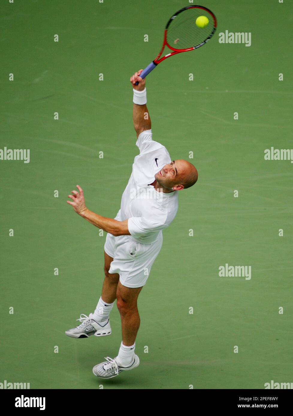 Andre Agassi of the U.S., serves on Rod Laver Arena during his second ...
