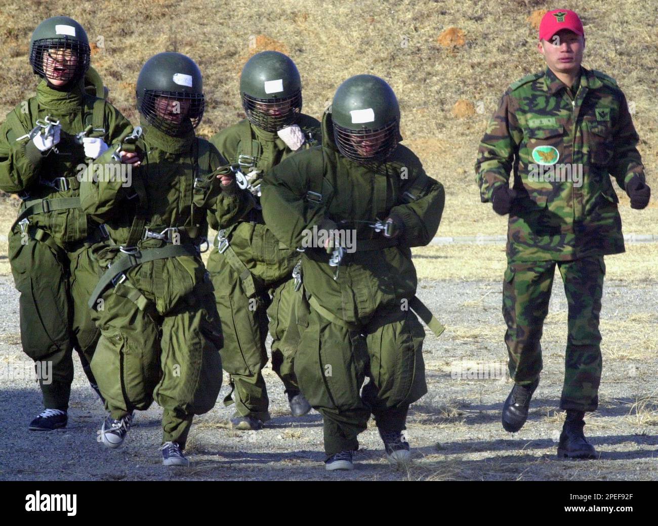 South Korean female middle school students run with a military soldier ...