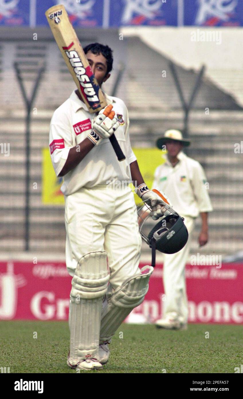 Bangladeshi cricketer Nafis Iqbal kisses his bat after completing his ...