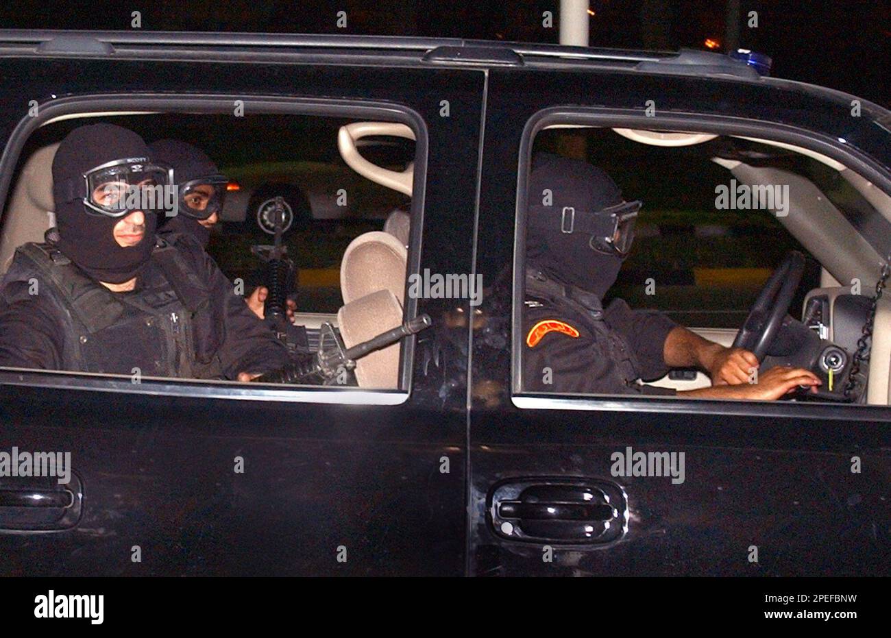 ** FILE ** A Kuwait Special Forces' Swat team drive pass while ...