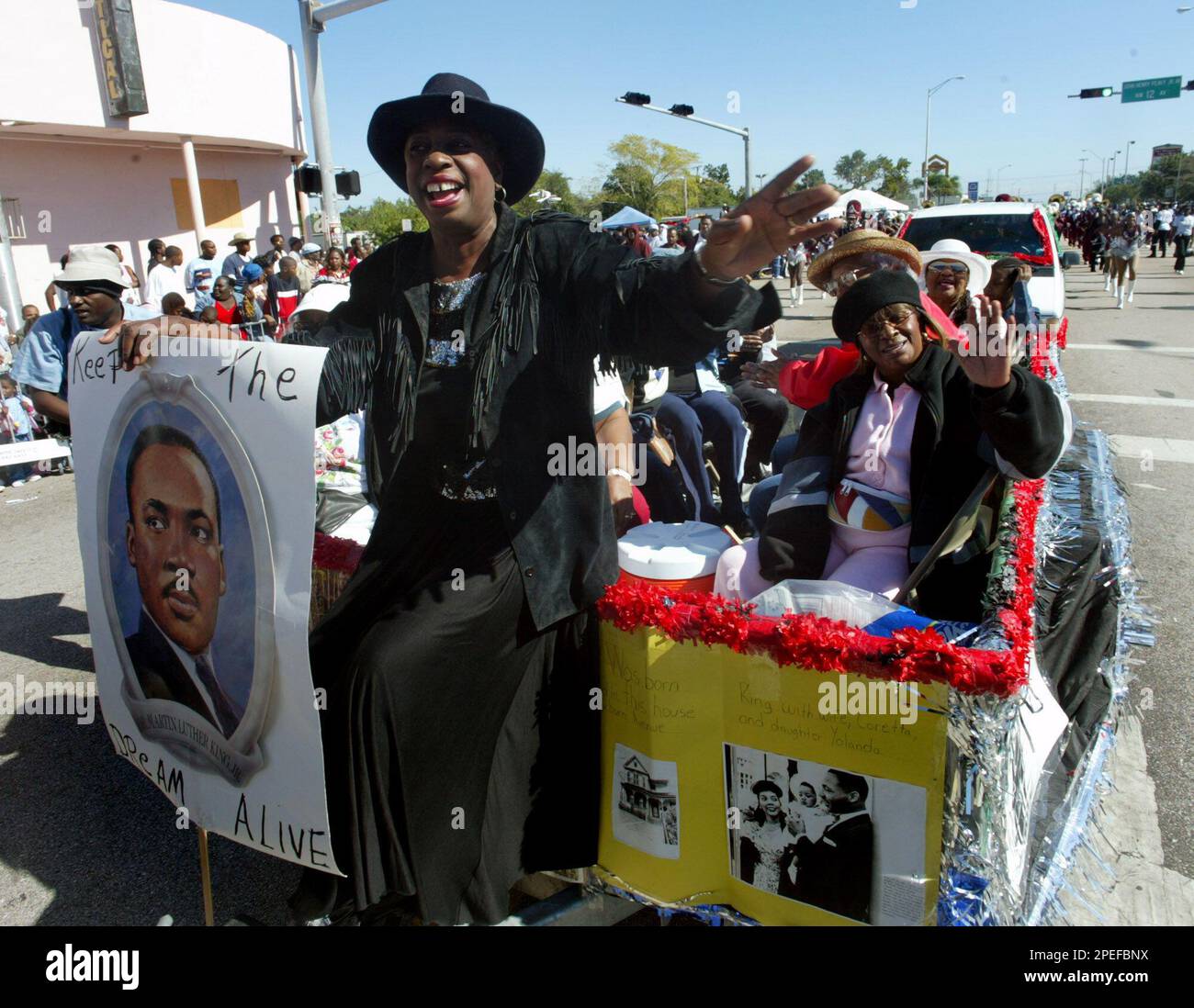 Women on a float wave to the crowds Monday, Jan. 17, 2005, during a ...