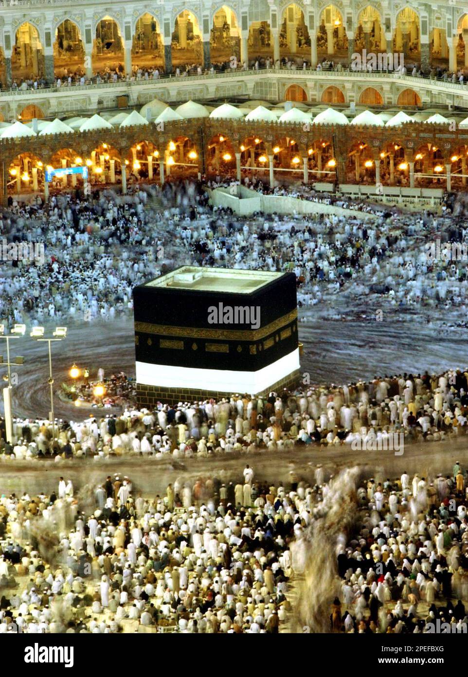Pilgrims circle the Kabaa at the Great mosque, Islam's holiest shrine ...