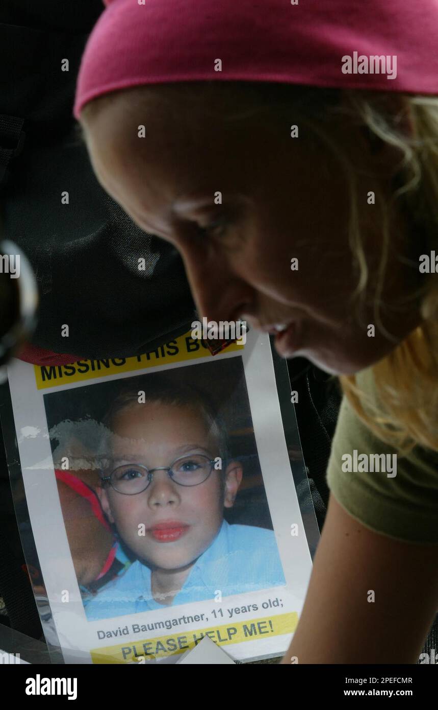 Michaela Wagner from Waler, Austria, sits in front of a portrait of her ...