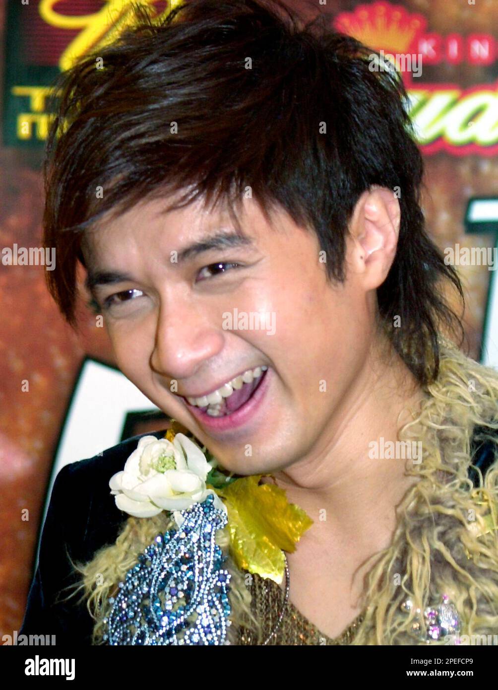 Hong Kong singer Leo Koo poses for photographers in the lobby of a Hong ...