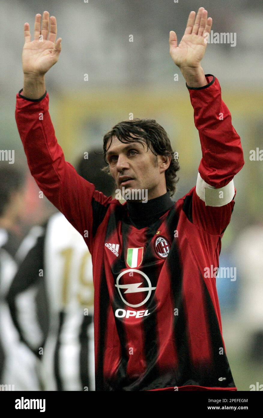 AC Milan defender Paolo Maldini waves to supporters as he walks off the ...
