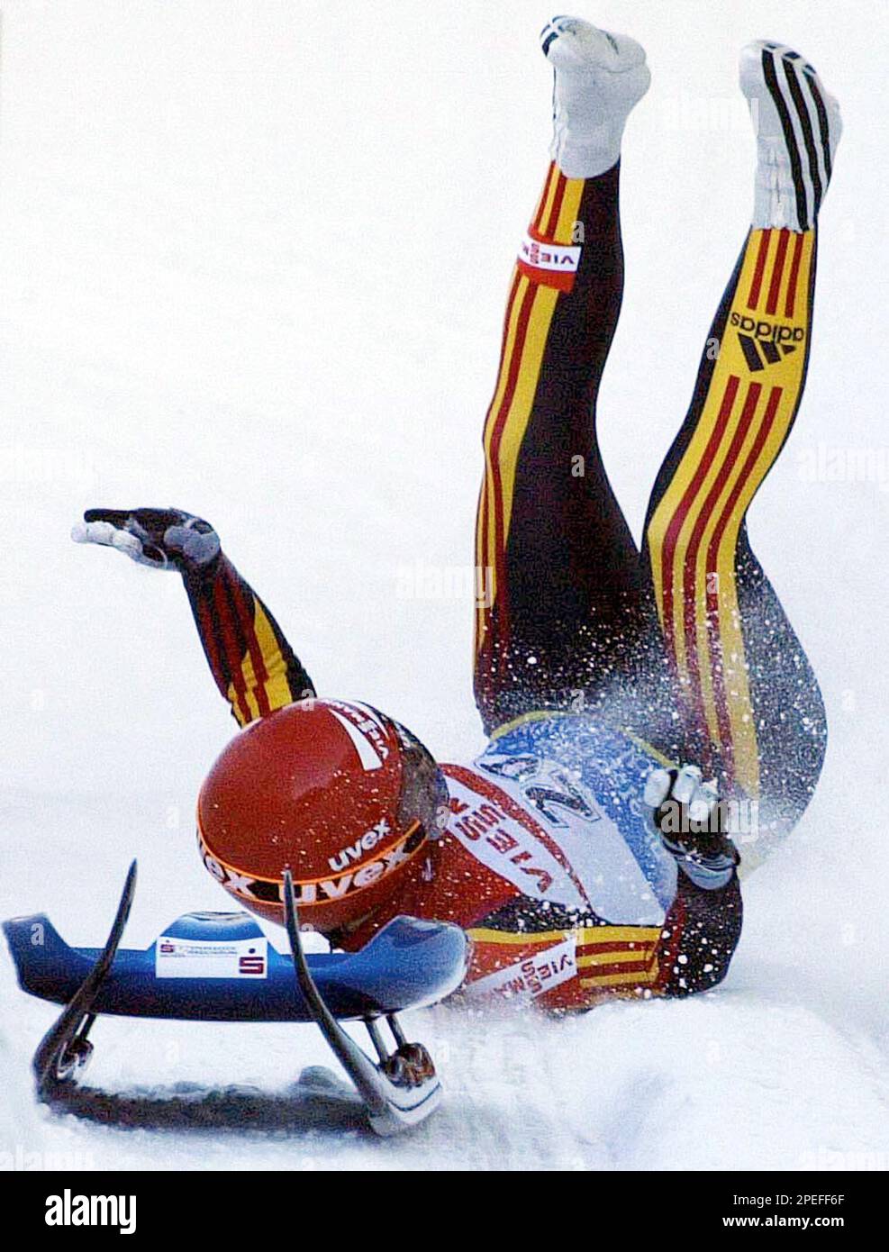 Germany's Sylke Otto falls from her sledge after crossing the finish ...