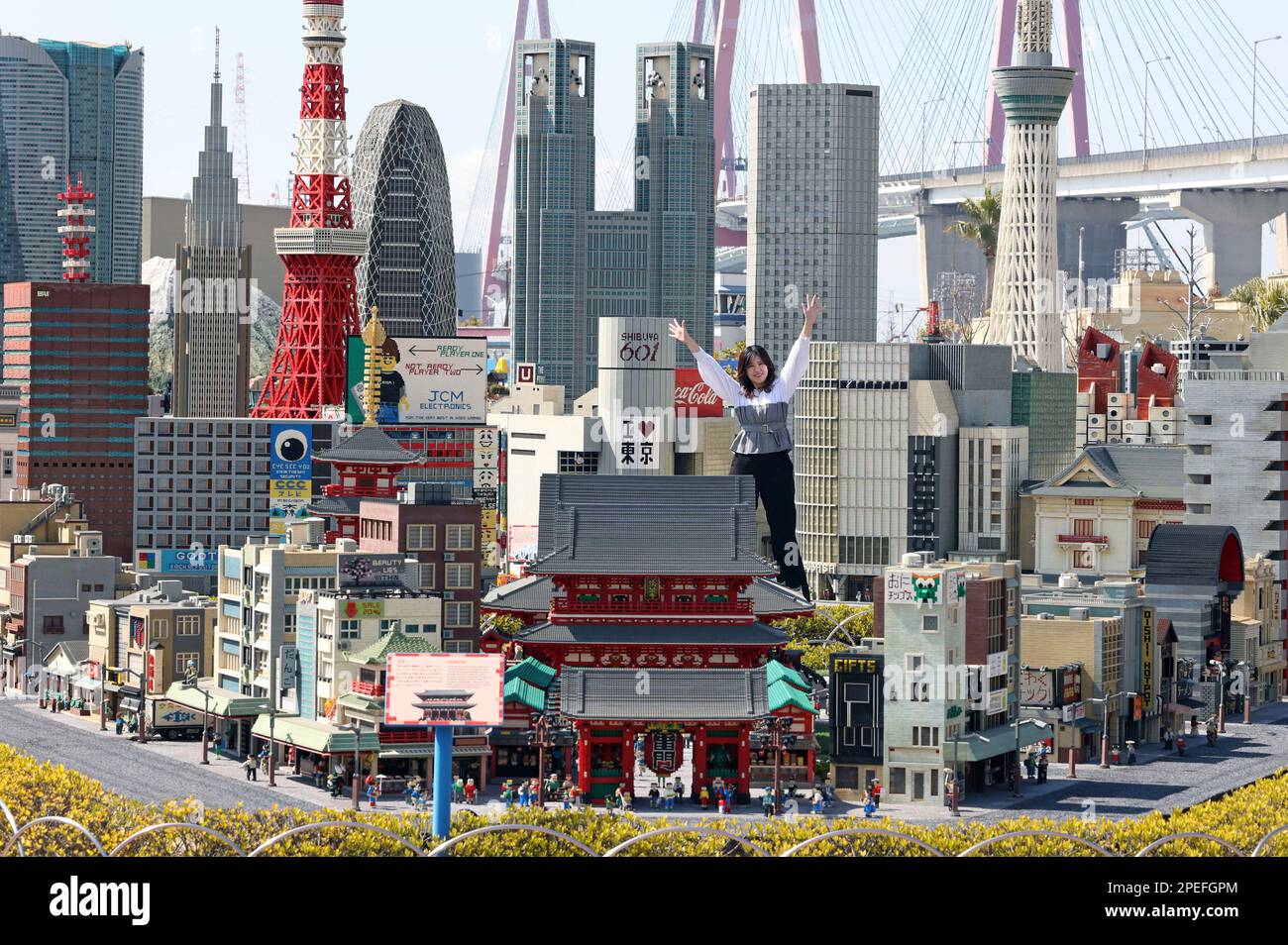A demonstrator of LEGOLAND Japan Resort stands in the middle of ...